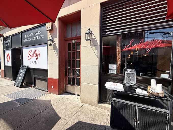Sally's exterior stands proud on Wooster Street, a beacon for anyone who understands that great pizza requires no pretense.