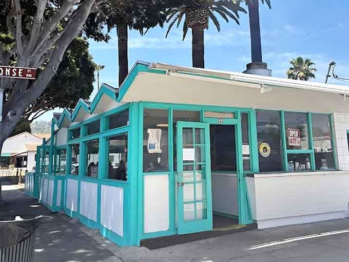 That turquoise and white exterior isn't just charming, it's a beacon calling you to taco paradise.