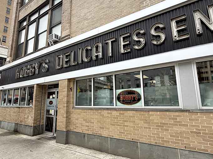Those big windows let you peek at decades of deli tradition happening in real time, right on the corner.