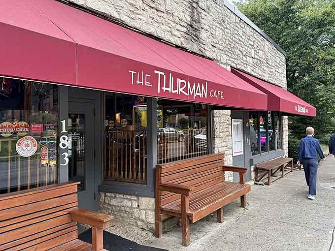 That red awning beckons like a siren song, promising burgers that'll change your life forever.