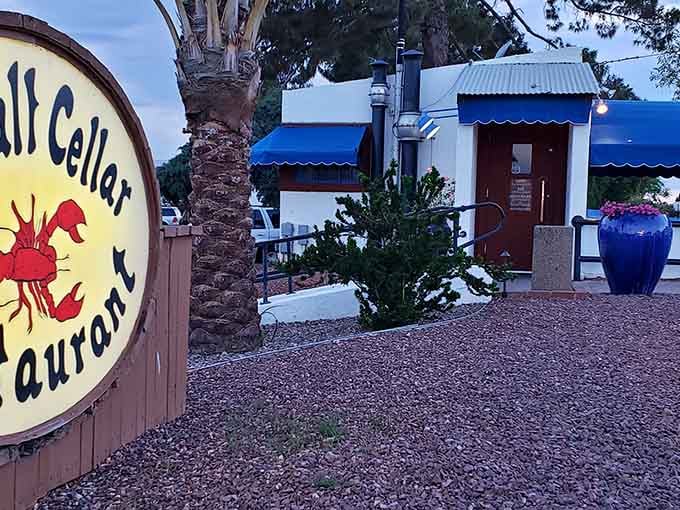 That cheerful lobster sign welcomes you to an underground seafood paradise hiding beneath the Arizona desert.