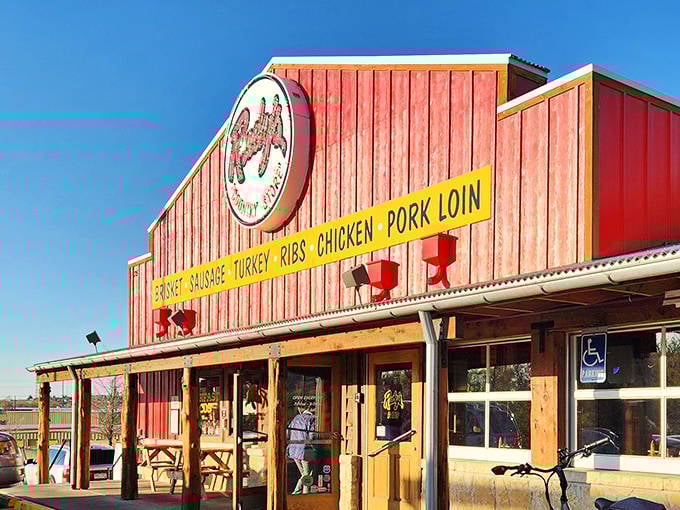 The iconic red exterior of Rudy's beckons like a barbecue lighthouse, promising smoky treasures within those rustic wooden walls.