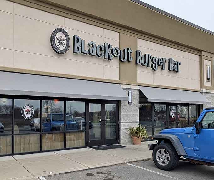 The unassuming exterior of Blackout Burger Bar hides culinary treasures within, like finding a diamond mine disguised as a hardware store.