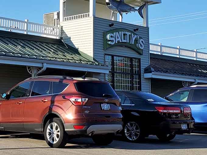 Afternoon sun catches Salty's distinctive green roof and shark signage, a beacon for prime rib enthusiasts and seafood lovers alike in Wisconsin's heartland.