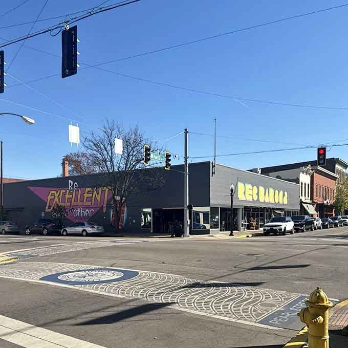 Downtown New Albany hides this colorful corner where nostalgia meets nightlife under clear blue skies.