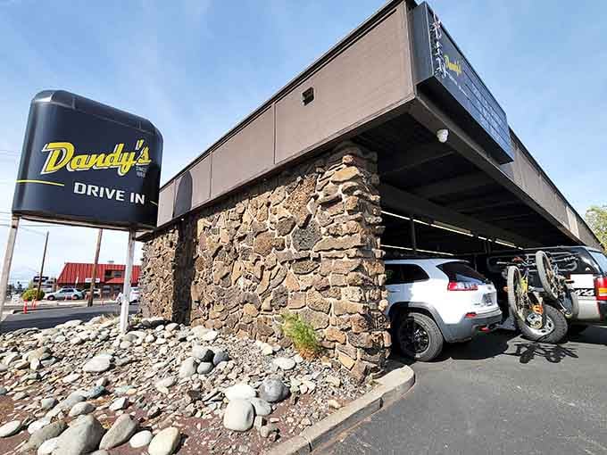 That stone pillar and vintage sign aren't just decoration, they're a promise that good things await under that canopy.
