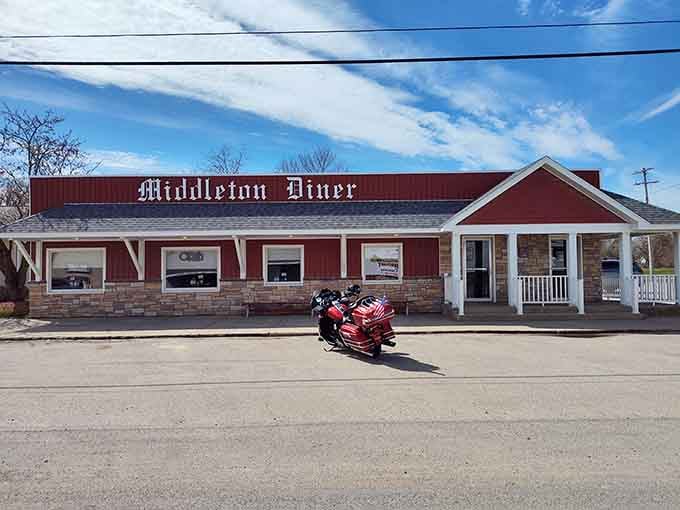 The iconic red exterior of Middleton Diner stands like a beacon of comfort food in rural Michigan, promising homestyle cooking and small-town charm.