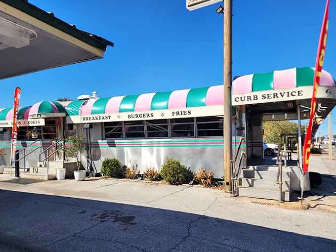 That turquoise and pink striped awning isn't just decoration; it's a beacon calling you home to 1950s America.