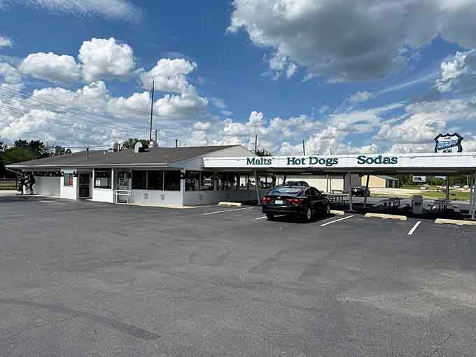 The wide canopy and vintage signage announce exactly what you need: malts, hot dogs, and sodas in glorious simplicity.