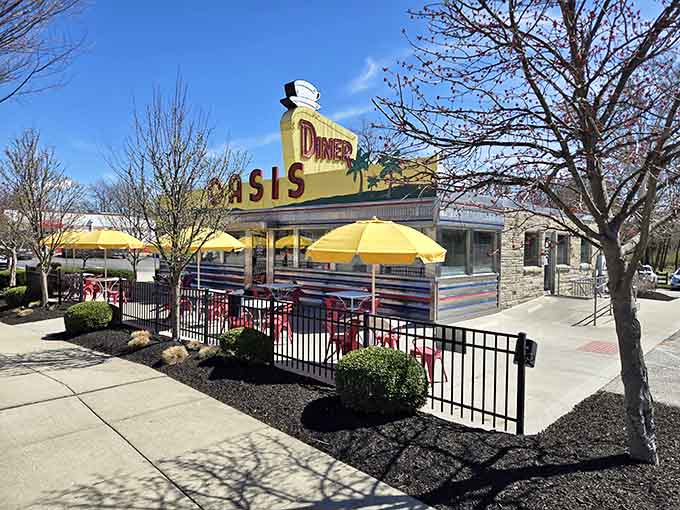 Those red chairs and yellow awnings are basically shouting "sit down, relax, and let us feed you like family" in the best way possible.