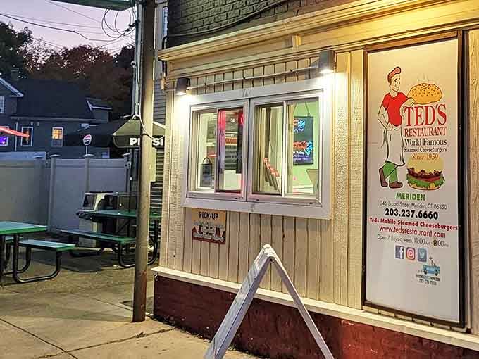 As evening falls, Ted's warm glow beckons burger pilgrims like a lighthouse guiding ships to dairy-drenched salvation.