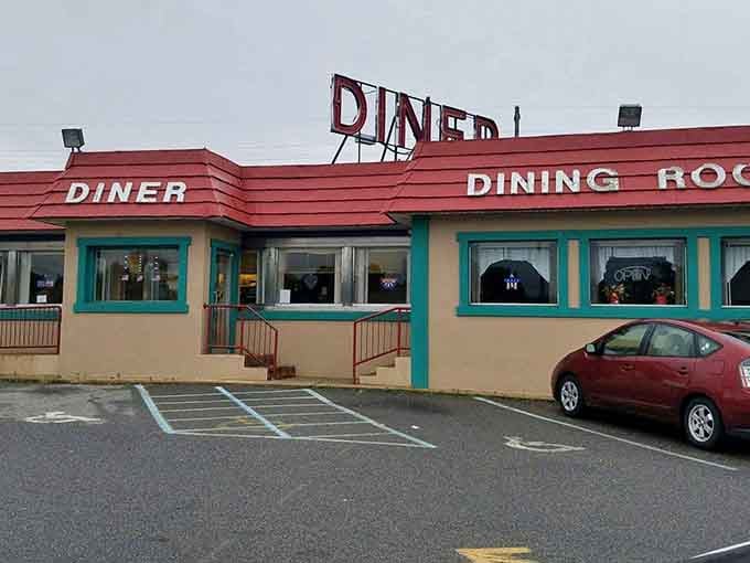 That bold red roof and turquoise trim aren't trying to be retro, they're the real McCoy of diner architecture.