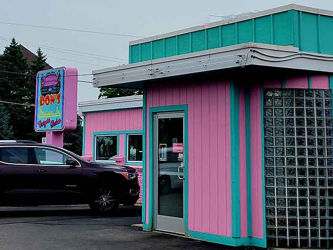 That pink-and-turquoise exterior isn't whispering, it's belting out a full-throated invitation to happiness.