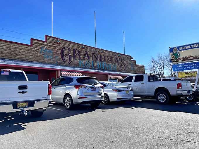 The brick-red exterior of Grandma's K & I Diner stands proudly against New Mexico's brilliant blue sky, a beacon of comfort food excellence.