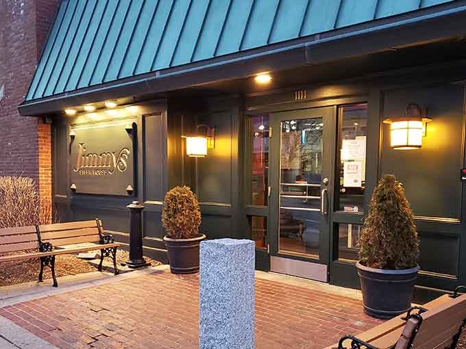 Jimmy's welcoming exterior beckons with its distinctive green awning and cozy benches. The perfect spot for hungry travelers to rest before their meaty adventure begins.