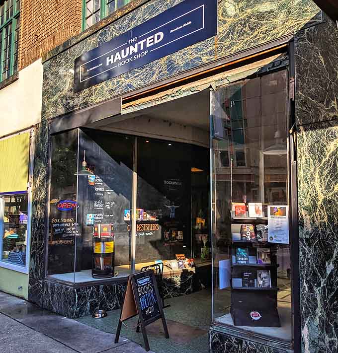 The distinctive storefront with its unique marble facade offers another entrance to Mobile's literary sanctuary, displaying new arrivals in the window.