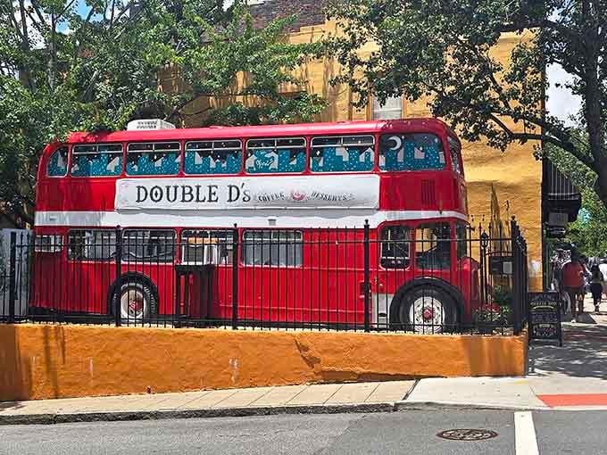 That magnificent red double-decker bus isn't lost; it found its perfect home serving coffee and joy in downtown Asheville.