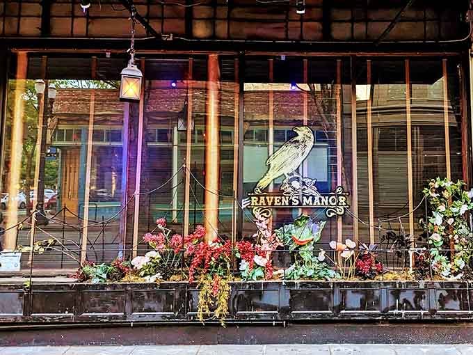 That golden raven logo isn't just decoration, it's a promise that normalcy ends at this threshold.