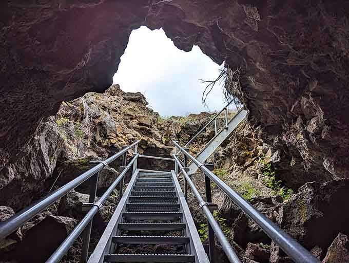 Climbing the stairs leads you from the depths of the cave to the bright sky above, bringing your exploration to a stunning close.