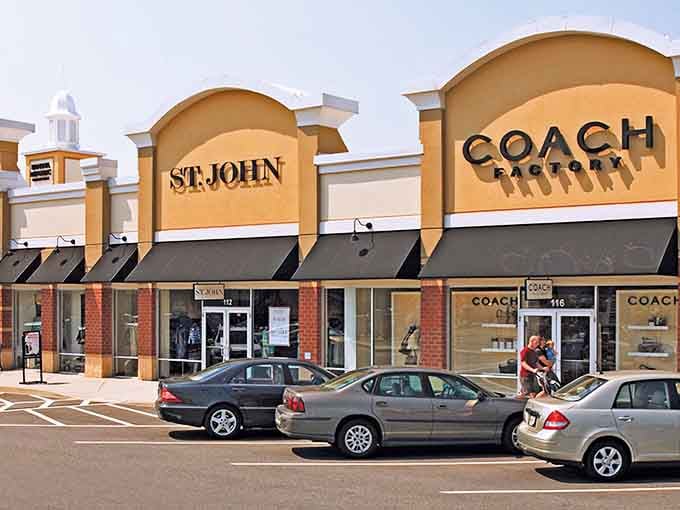 The retail promised land beckons with Coach and St. John storefronts standing like designer sentinels, guarding treasures at prices that won't require a second mortgage.