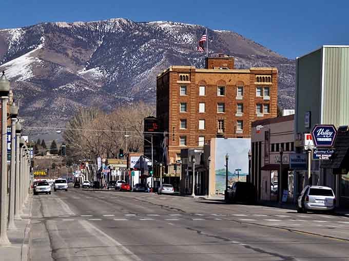 Downtown Ely with its historic Hotel Nevada standing tall against a backdrop of snow-dusted mountains – small-town charm with big-time views.