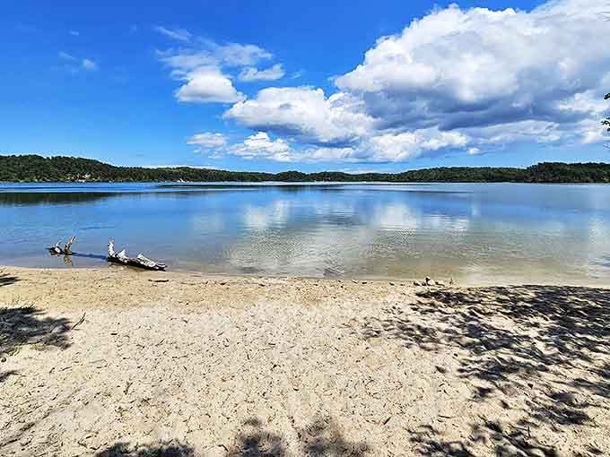 Mirror-like waters reflect puffy clouds at this Cape Cod kettle pond. Mother Nature showing off her best selfie angle at Nickerson State Park.