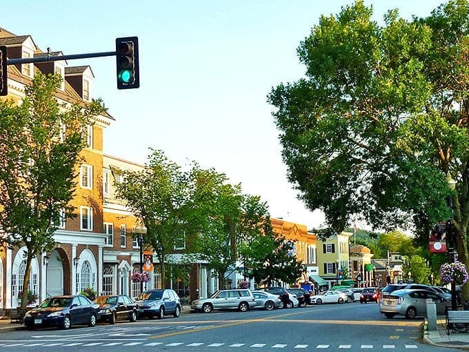 Hanover's charming Main Street at golden hour, where historic buildings house local shops and restaurants in a walkable downtown setting.