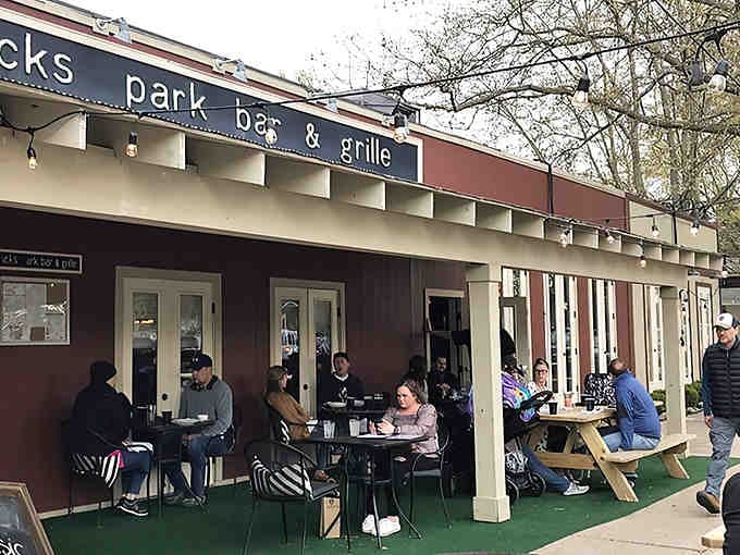 The covered patio with its green turf flooring proves that comfort doesn't need to be complicated or fancy.