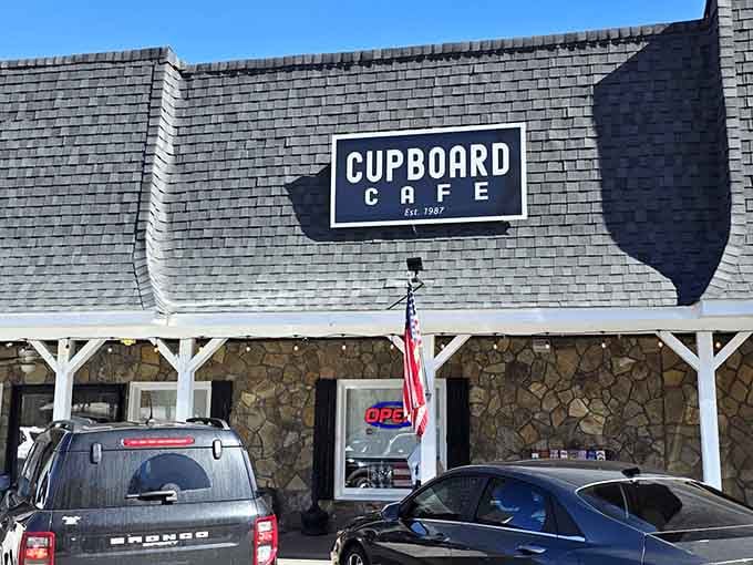 That stone facade and covered porch are basically whispering "come inside, we've got something good waiting for you."