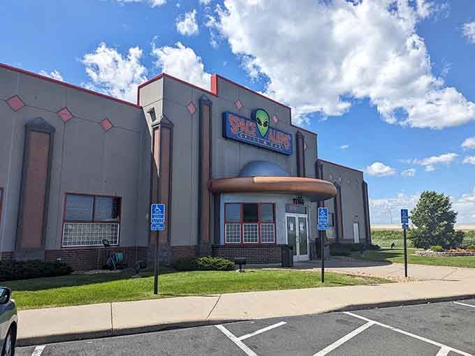 That futuristic facade isn't a mirage; it's your dinner destination looking like it landed from another galaxy.