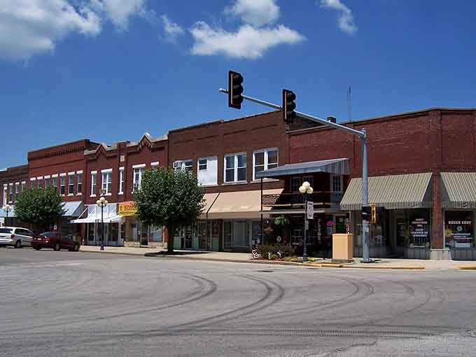 Classic small-town America at its finest, where brick buildings meet blue skies and giant surprises await around every corner.