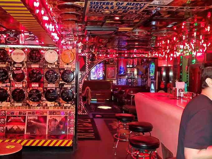 The red glow transforms everything into pure visual poetry, like stepping inside a neon dream.