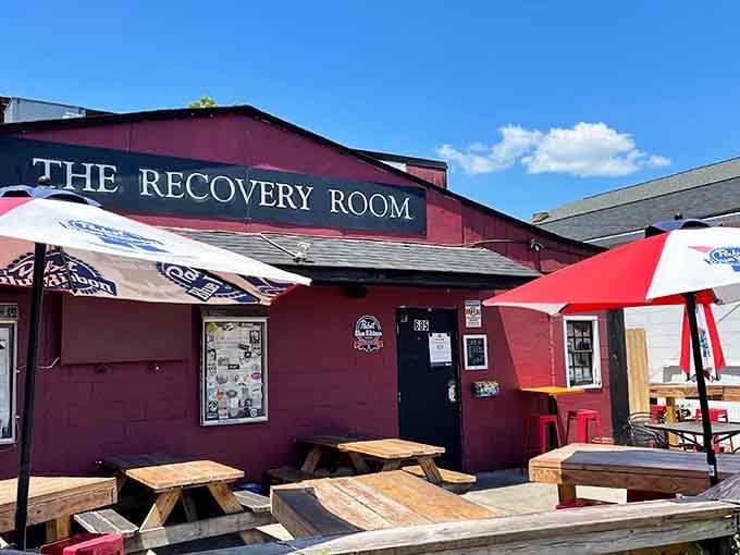 That deep burgundy exterior isn't trying to hide what's inside, it's proudly announcing dive bar paradise ahead.