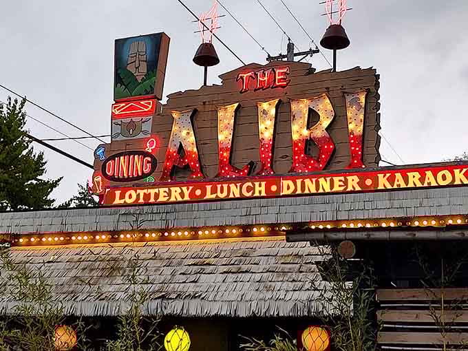 The thatched roof and bold neon sign make The Alibi impossible to miss on your drive through Northeast Portland.