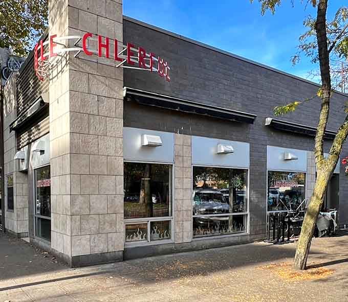 That cheerful red sign isn't lying, this corner cafe delivers exactly what it promises with zero pretense.