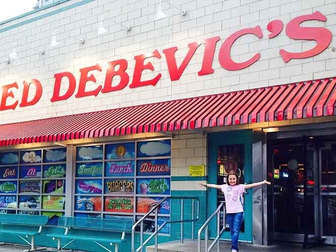 That striped awning and turquoise trim practically scream "Come get your burger and your sass!" in neon letters.