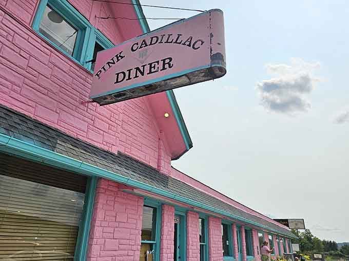 Pink walls, turquoise trim, and that vintage sign&mdash;proof that the best comfort food starts before you taste it.