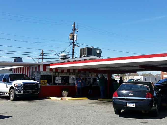 The iconic red and white striped awning of Shady Lane Drive Inn stands as a beacon of hope for hungry travelers and locals alike. Simple perfection awaits.
