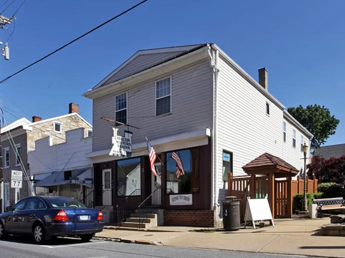 Small-town charm meets mountain majesty on Thurmont's quiet streets, where American flags outnumber traffic lights.