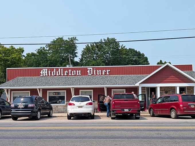 The iconic red exterior of Middleton Diner stands like a beacon of comfort food in rural Michigan, promising homestyle cooking and small-town charm.