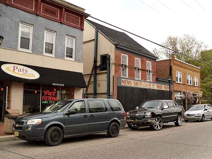 Classic storefronts line the street, each one telling stories that predate your parents' parents with quiet dignity.