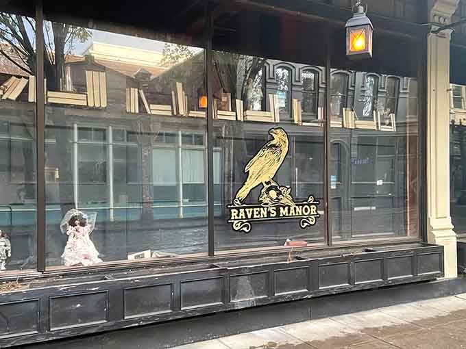 That golden raven logo isn't just decoration, it's a promise that normalcy ends at this threshold.