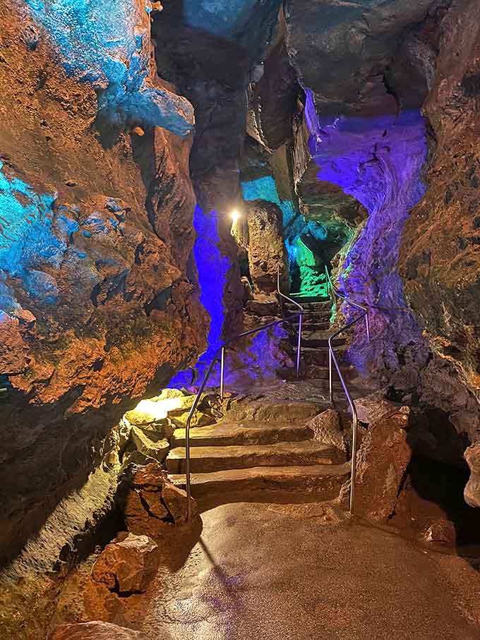 Those vibrant blues and purples illuminating ancient limestone walls make you feel like you've stepped into a sci-fi movie set underground.