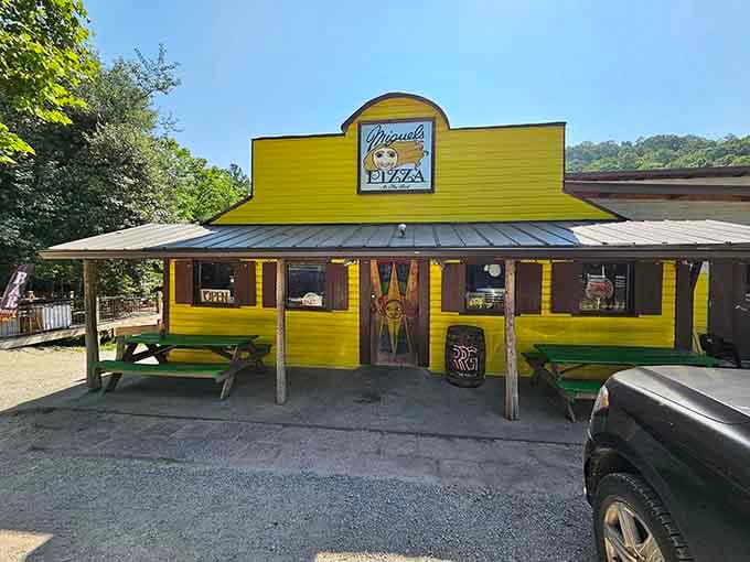That cheerful yellow facade isn't just bright, it's a promise of pizza and adventure waiting inside.