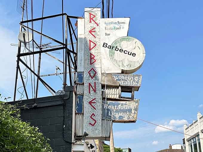 That vintage sign towers above Davis Square like a beacon calling all carnivores home to salvation.