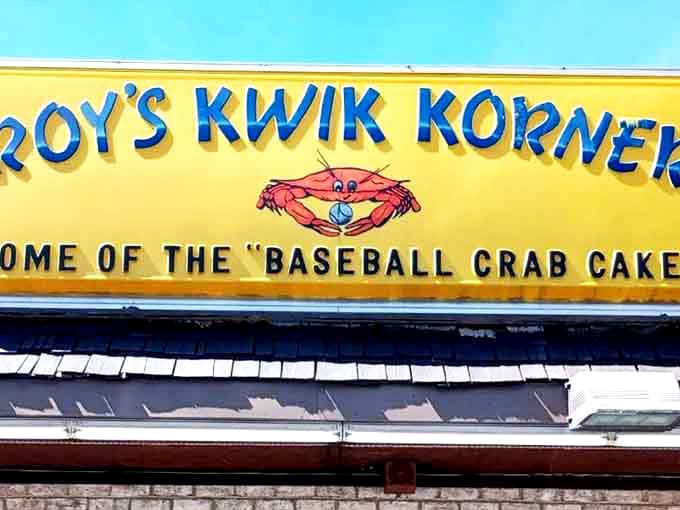 The unmistakable yellow beacon of Roy's Kwik Korner stands out against the Maryland sky like a culinary lighthouse guiding hungry travelers home.