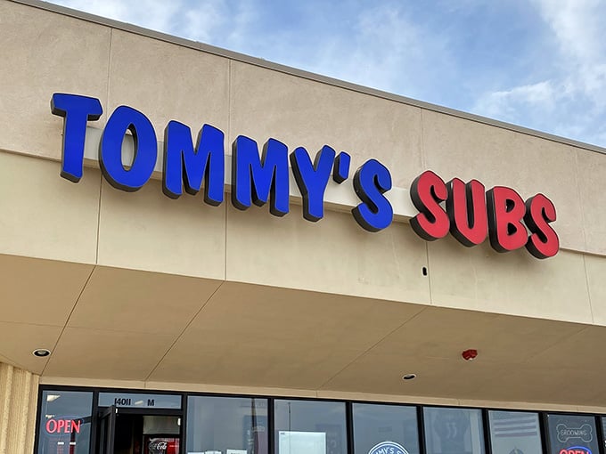 Those bold blue and red letters aren't just signage, they're a promise of submarine sandwich excellence waiting inside.