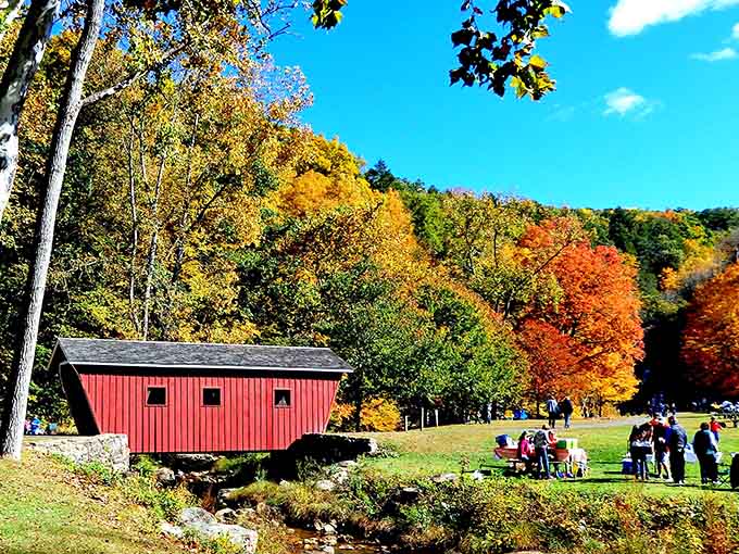 Fall foliage so vibrant it makes your screensaver jealous, with a covered bridge for maximum New England charm.