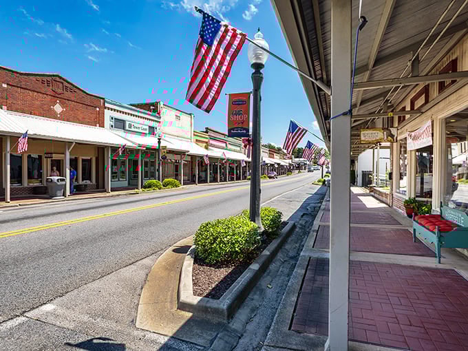Main Street Hartselle, where American flags flutter like welcome banners and time slows to a pace that makes your cardiologist smile.