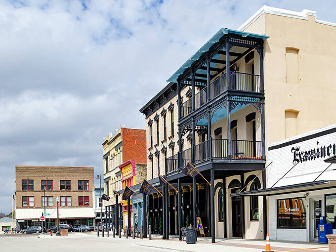 Downtown Navasota's historic buildings stand like well-preserved time travelers, their wrought-iron balconies whispering stories of Texas past while welcoming modern visitors.